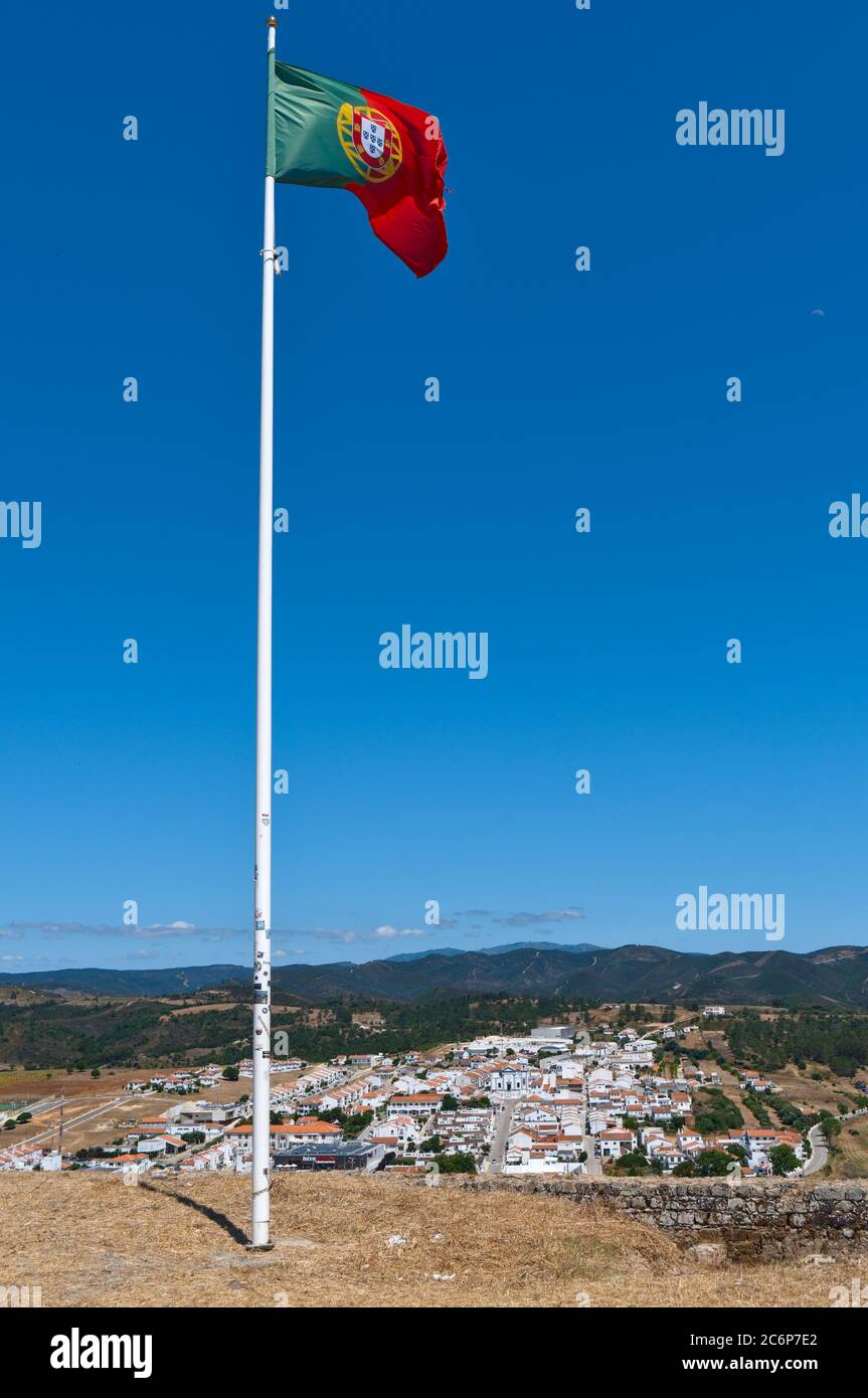 Portuguese flag and Aljezur viewed from the castle. Algarve, Portugal ...