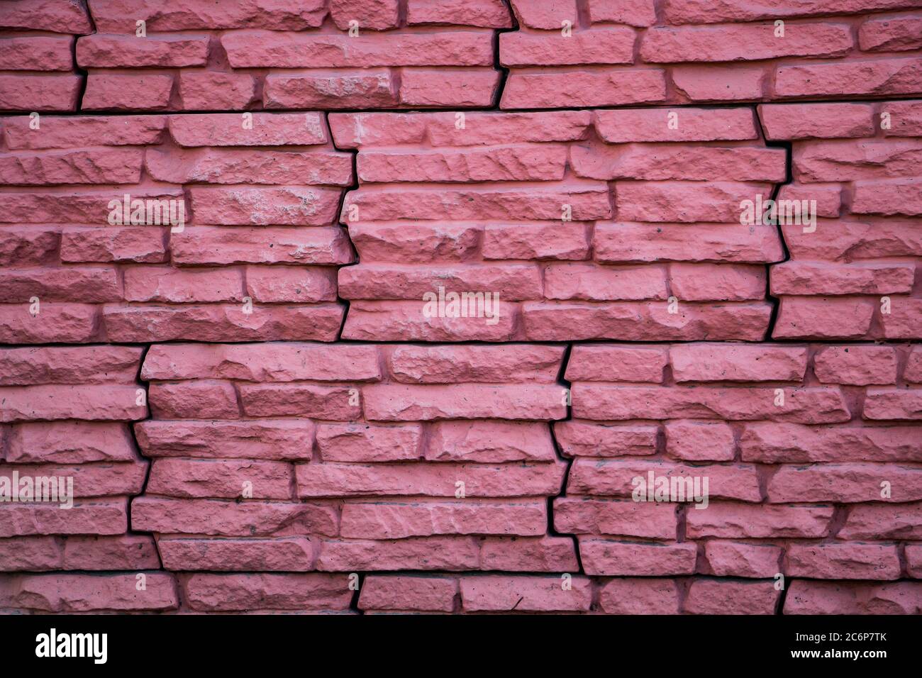 Pink stone wall, house facade Stock Photo - Alamy