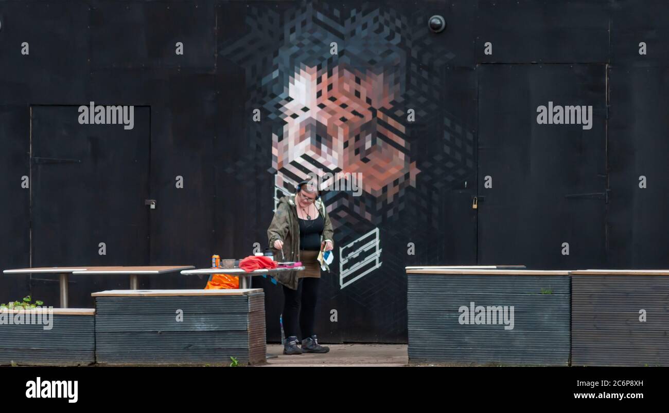 Glasgow, Scotland, UK. 11th July, 2020. An artist at work on a new ...