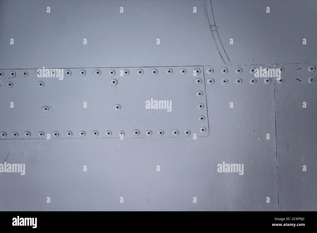 Aircraft skin close up. Rivets on gray metal. Background for design ...
