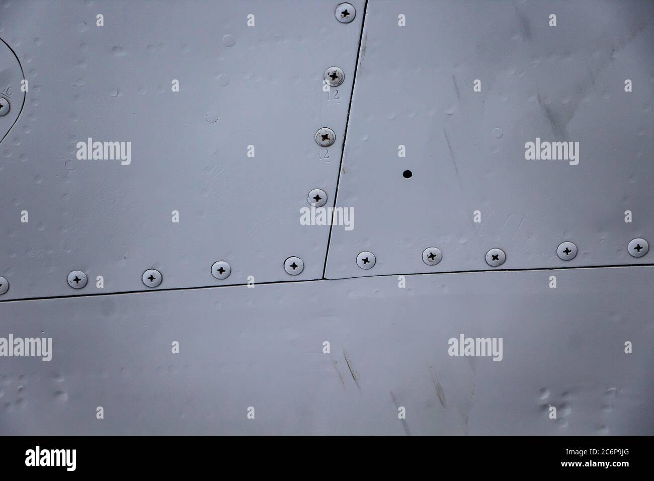 Aircraft skin close up. Rivets on gray metal. Background for design ...