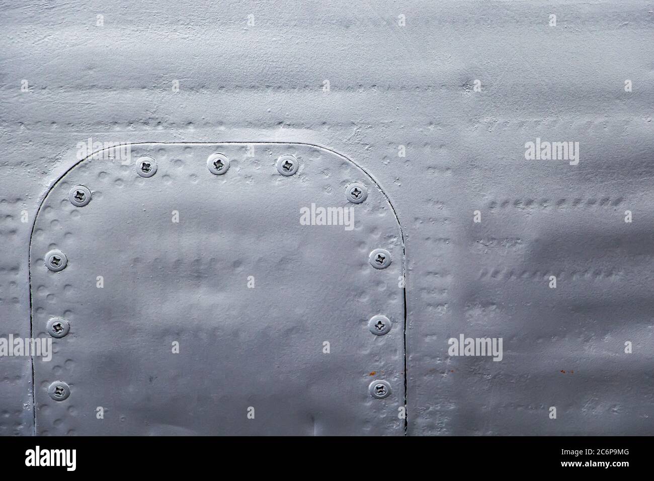 Aircraft skin close up. Rivets on gray metal. Background for design ...