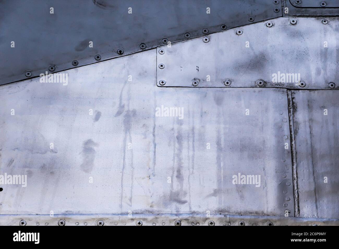 Aircraft skin close up. Rivets on gray metal. Aluminum texture Stock ...