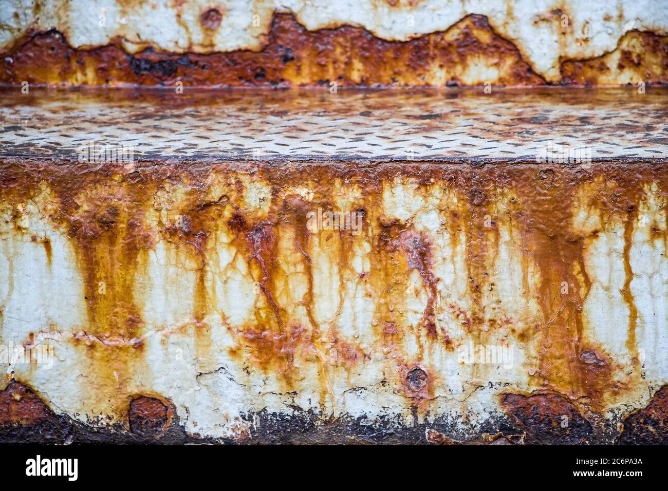 The texture of the old rusty metal. Streaks of rust on a white ...