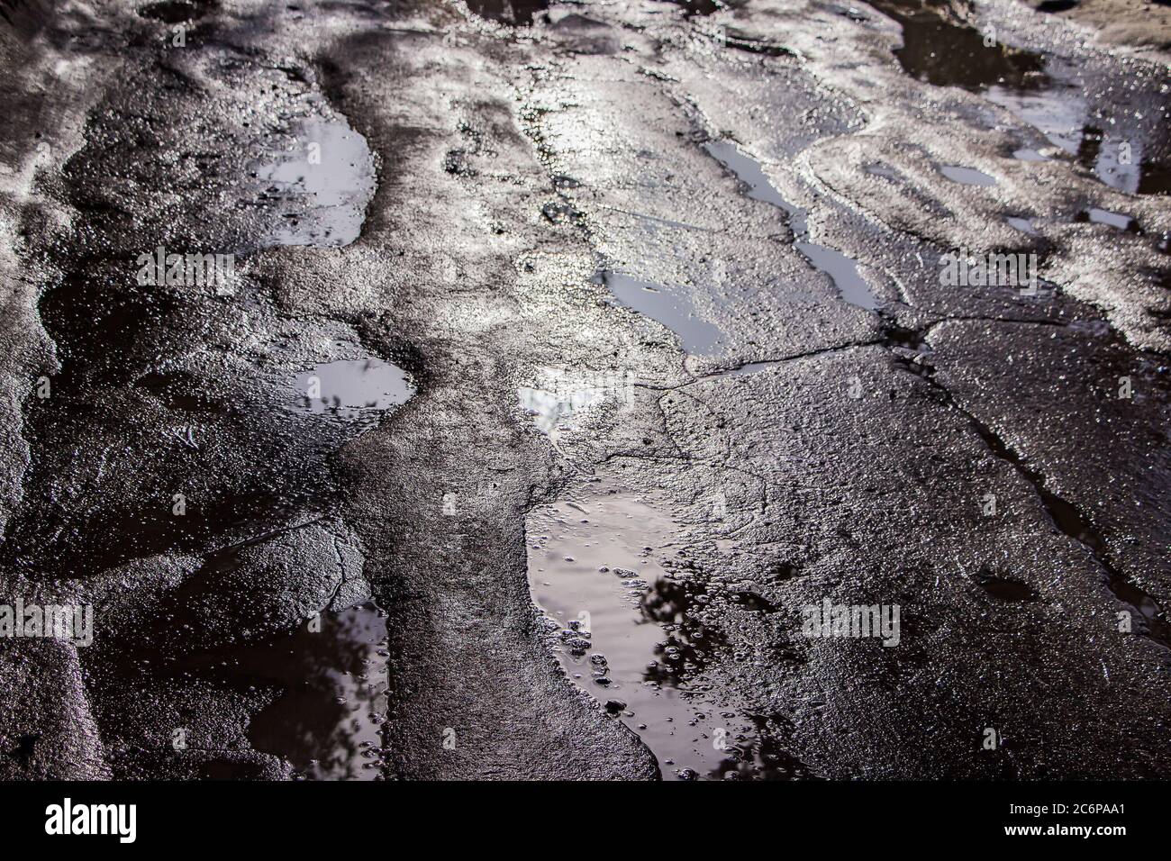 Melted snow on an asphalt road in Russia Stock Photo - Alamy