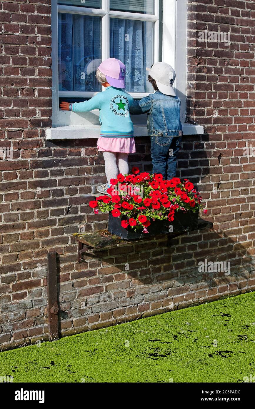 manequins looking into window, boy, girl, children, flower box, canal ...