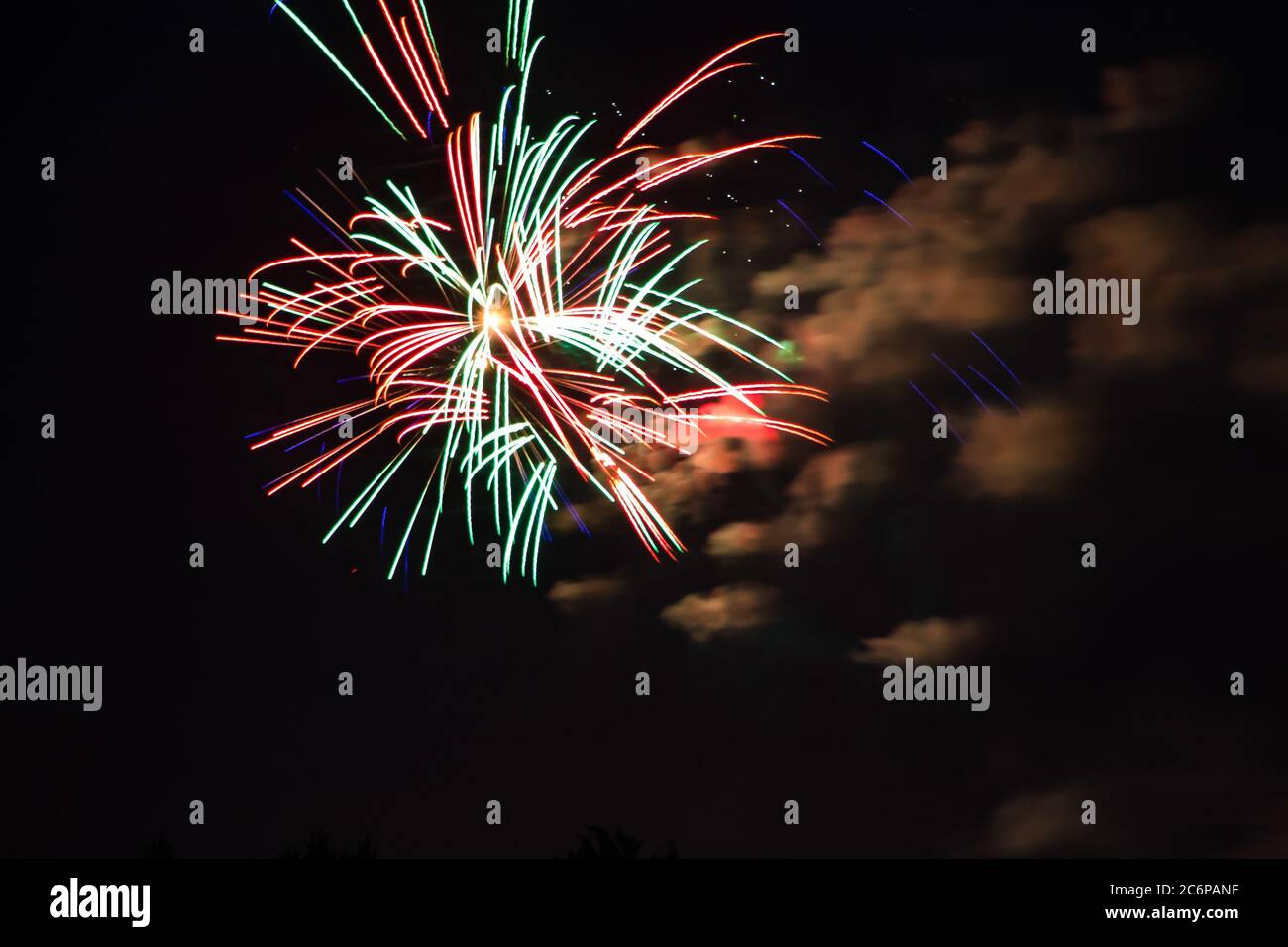 Beautiful multi-colored festive fireworks in the night sky Stock Photo ...