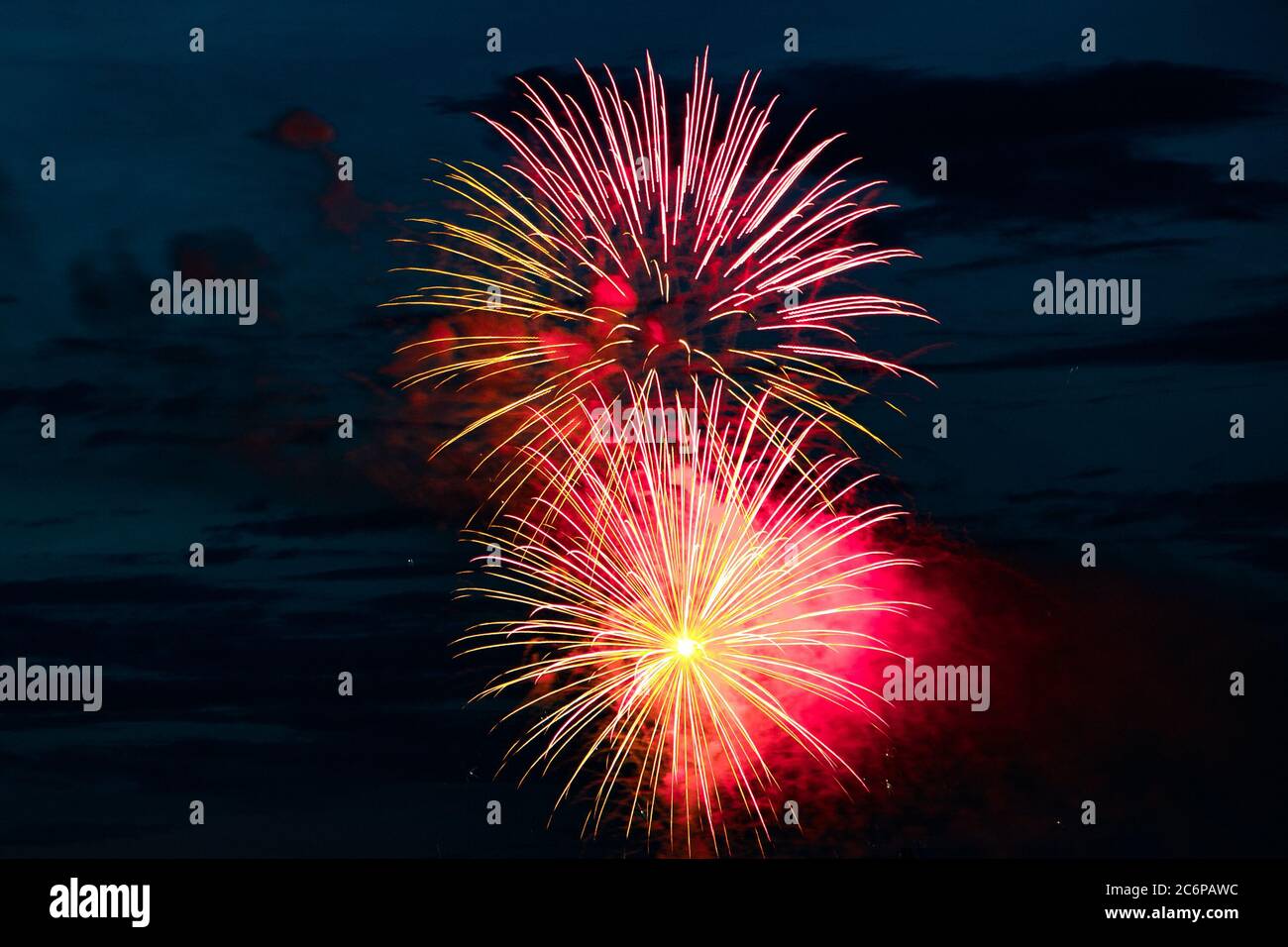 Beautiful multi-colored festive fireworks in the night sky Stock Photo ...
