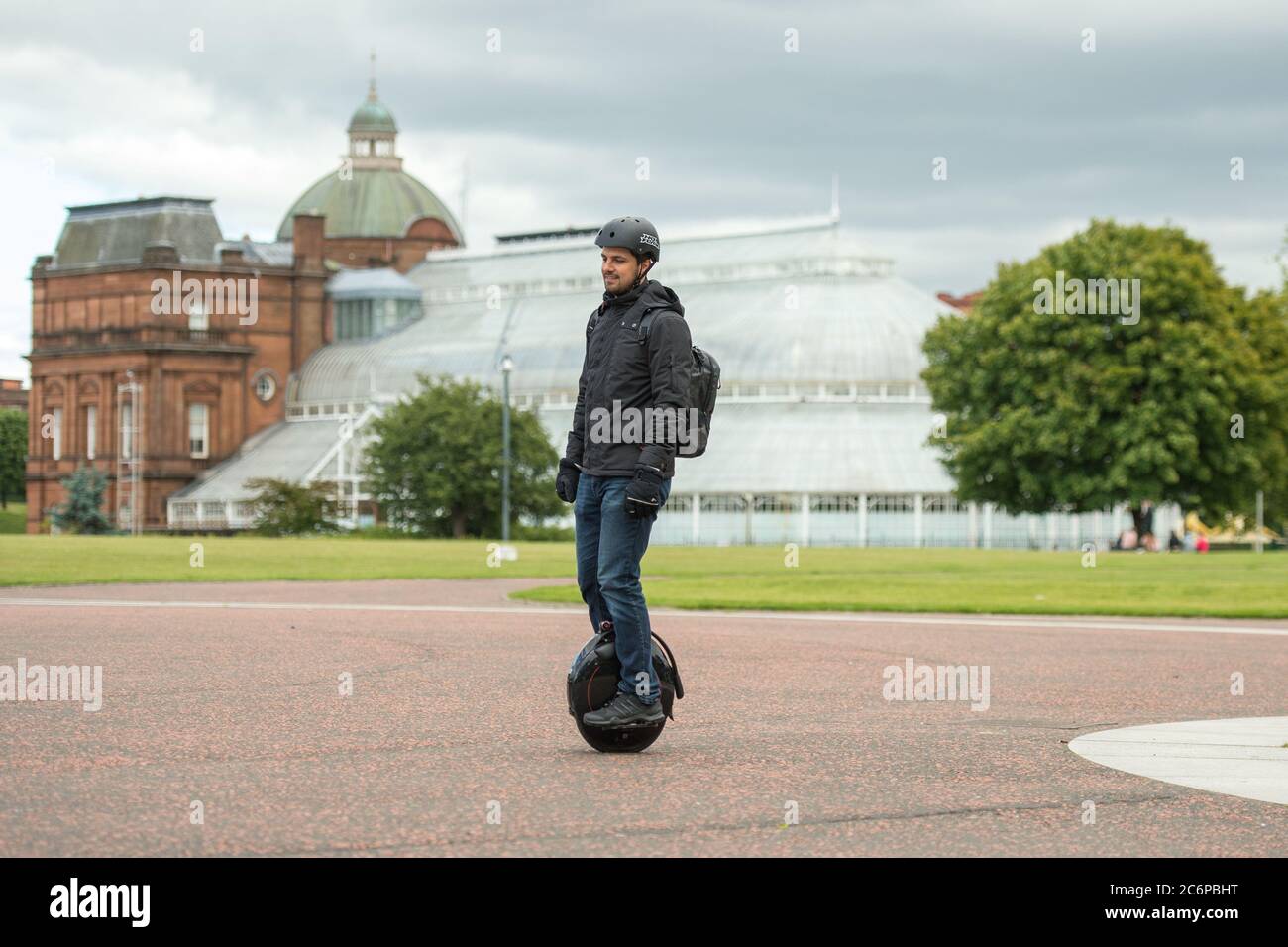 Man riding unicycle hi-res stock photography and images - Alamy