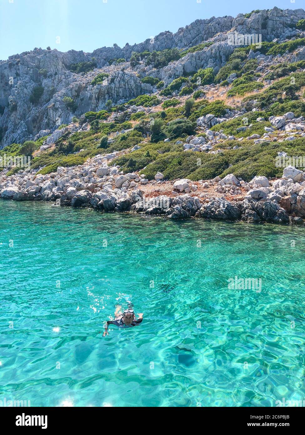 woman in beautiful turquoise color sea Stock Photo - Alamy