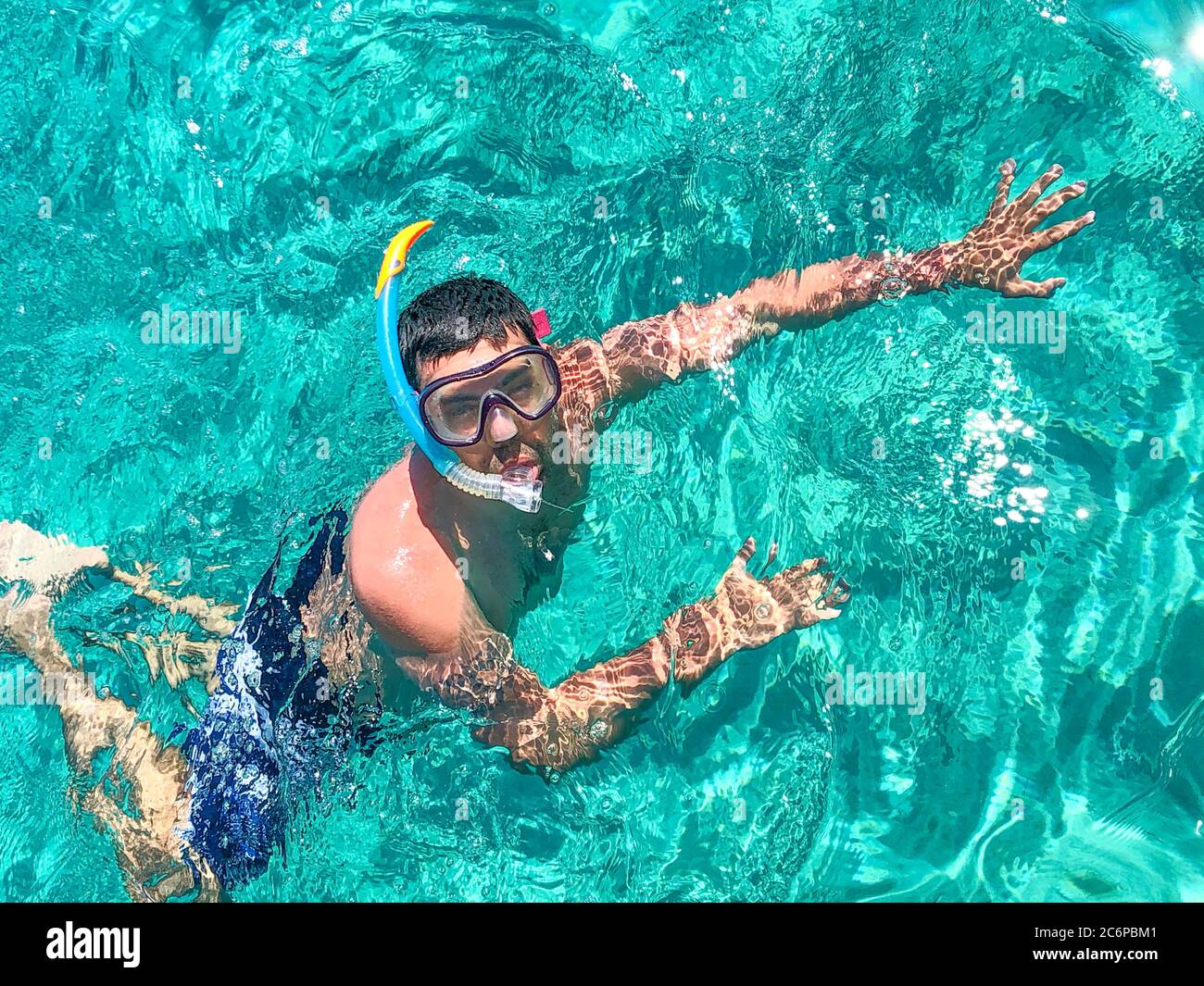 swimming and snorkeling man in beautiful turquoise color sea Stock ...