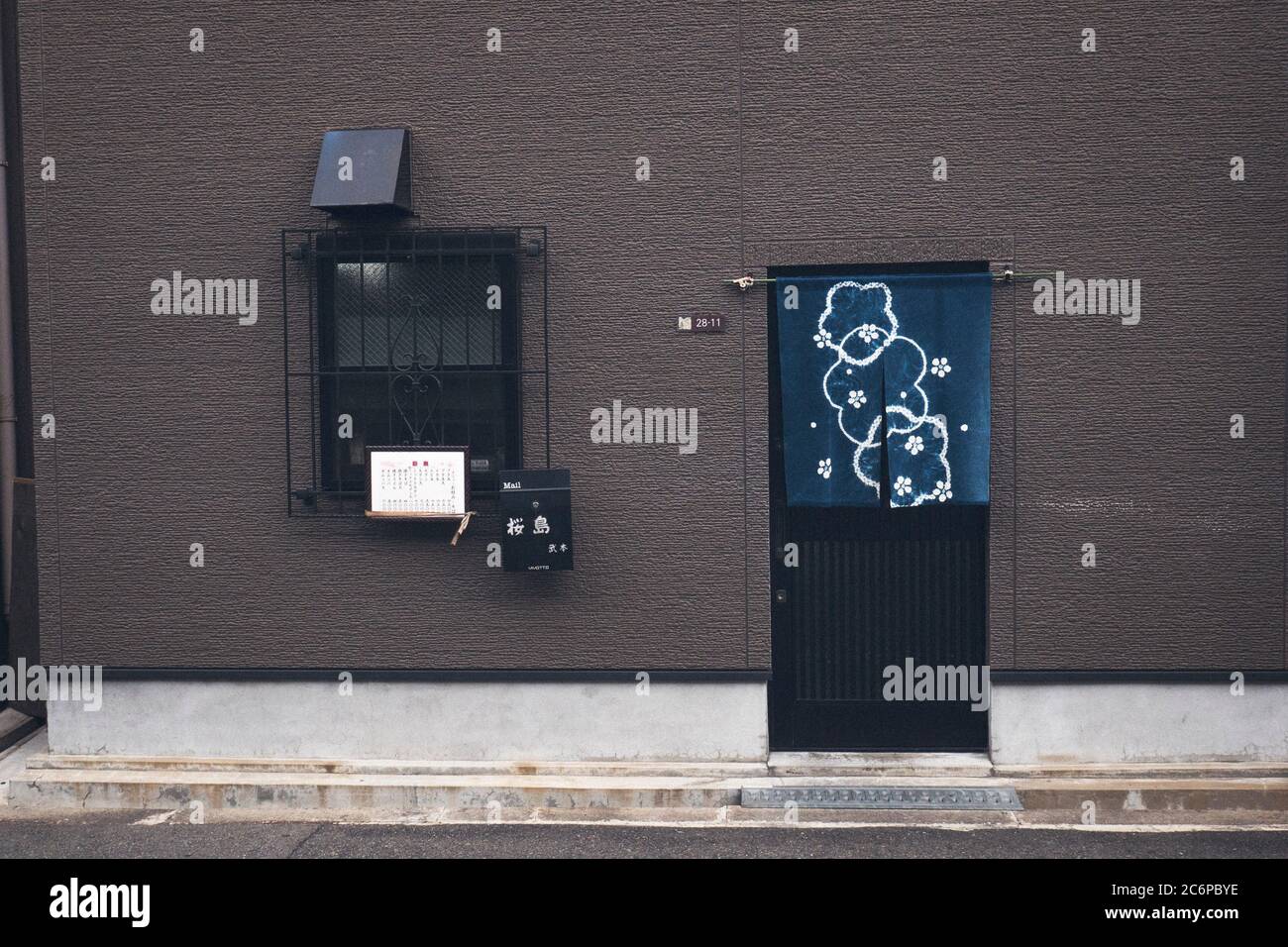 Black door and window, city of Osaka Japan Stock Photo - Alamy