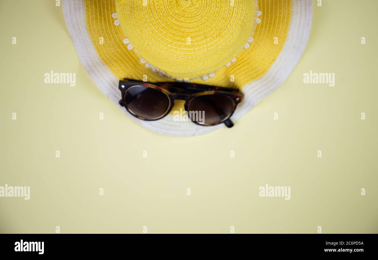 Beach accessories on a yellow background summer and the sea are ready ...