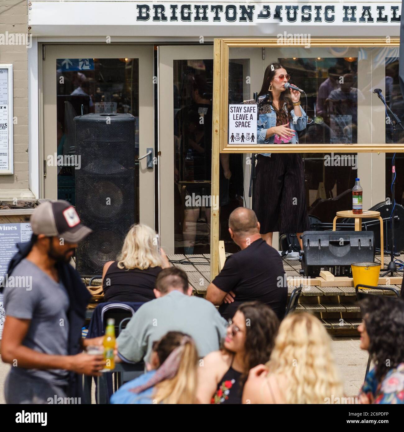 A singer performs behind a screen at brighton music hall hi-res stock ...