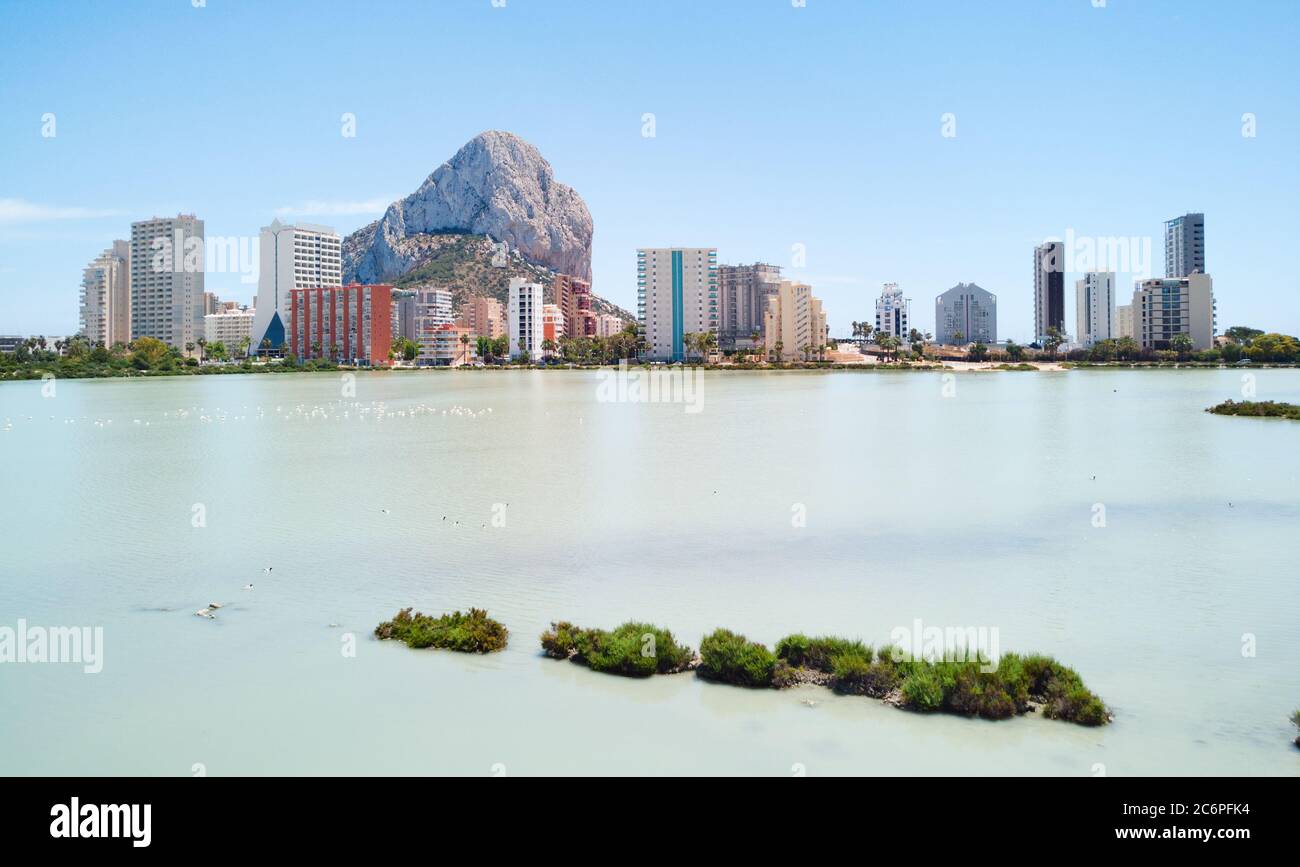 Urban skyline of Calpe. High rise residential buildings against blue ...