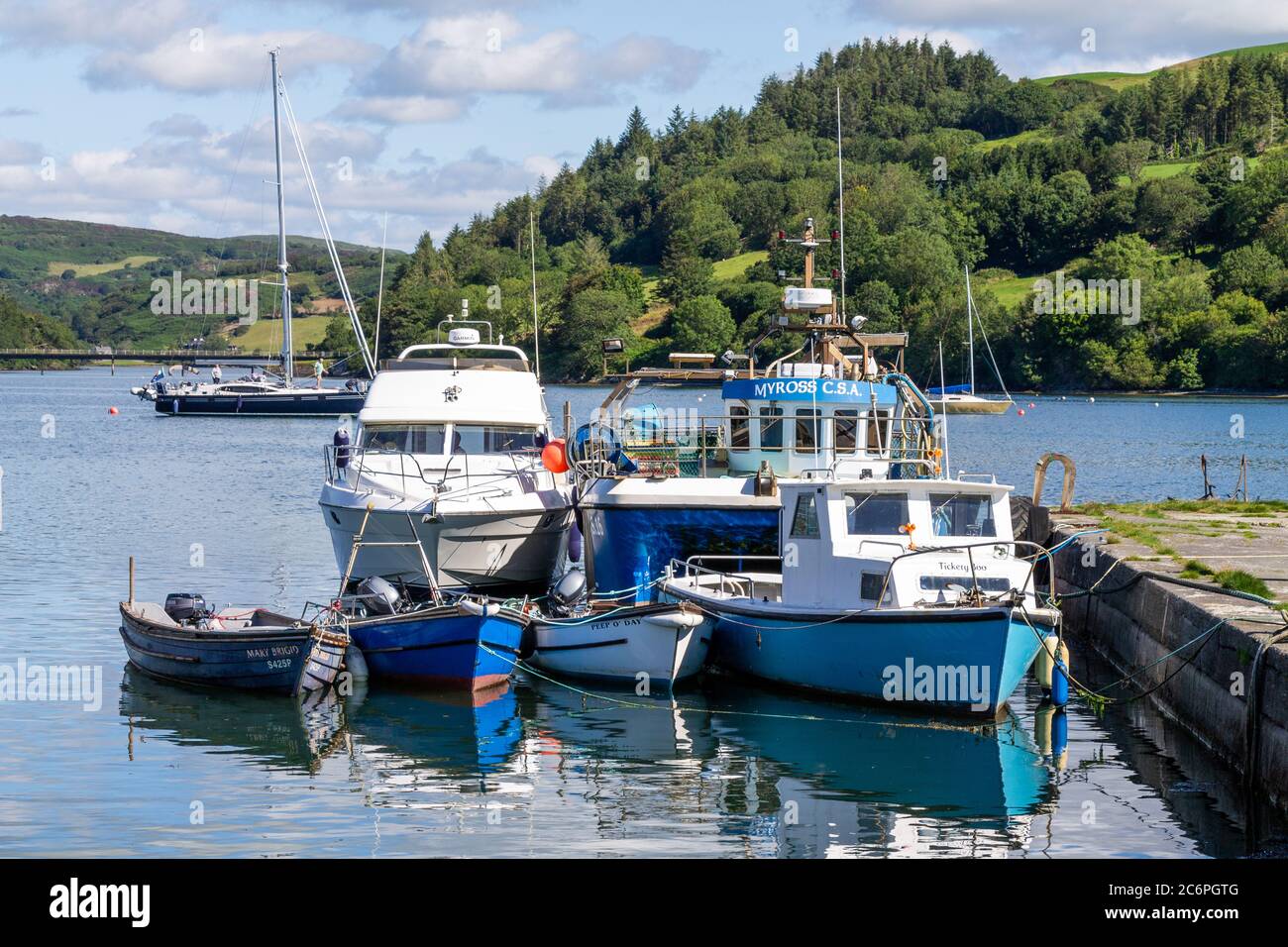 Boats tied up alongside a pier in Union Hall, West Cork, Ireland Stock ...