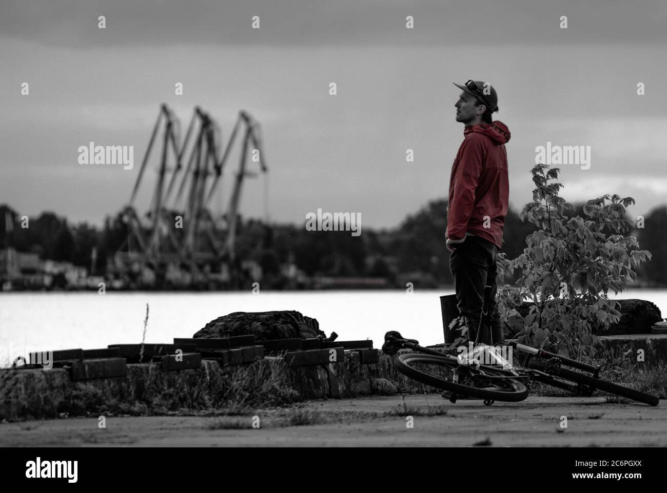 Side view of a man looking at river by Brooklyn Bridge Stock Photo - Alamy