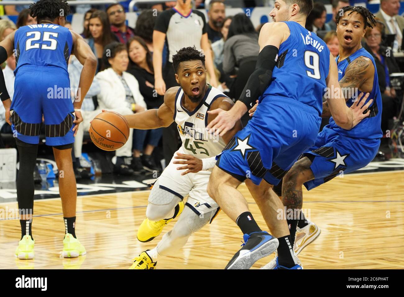 Utah Jazz's Donavan MItchell (#45) runs pass Orlando's Nikola Vucevic ...