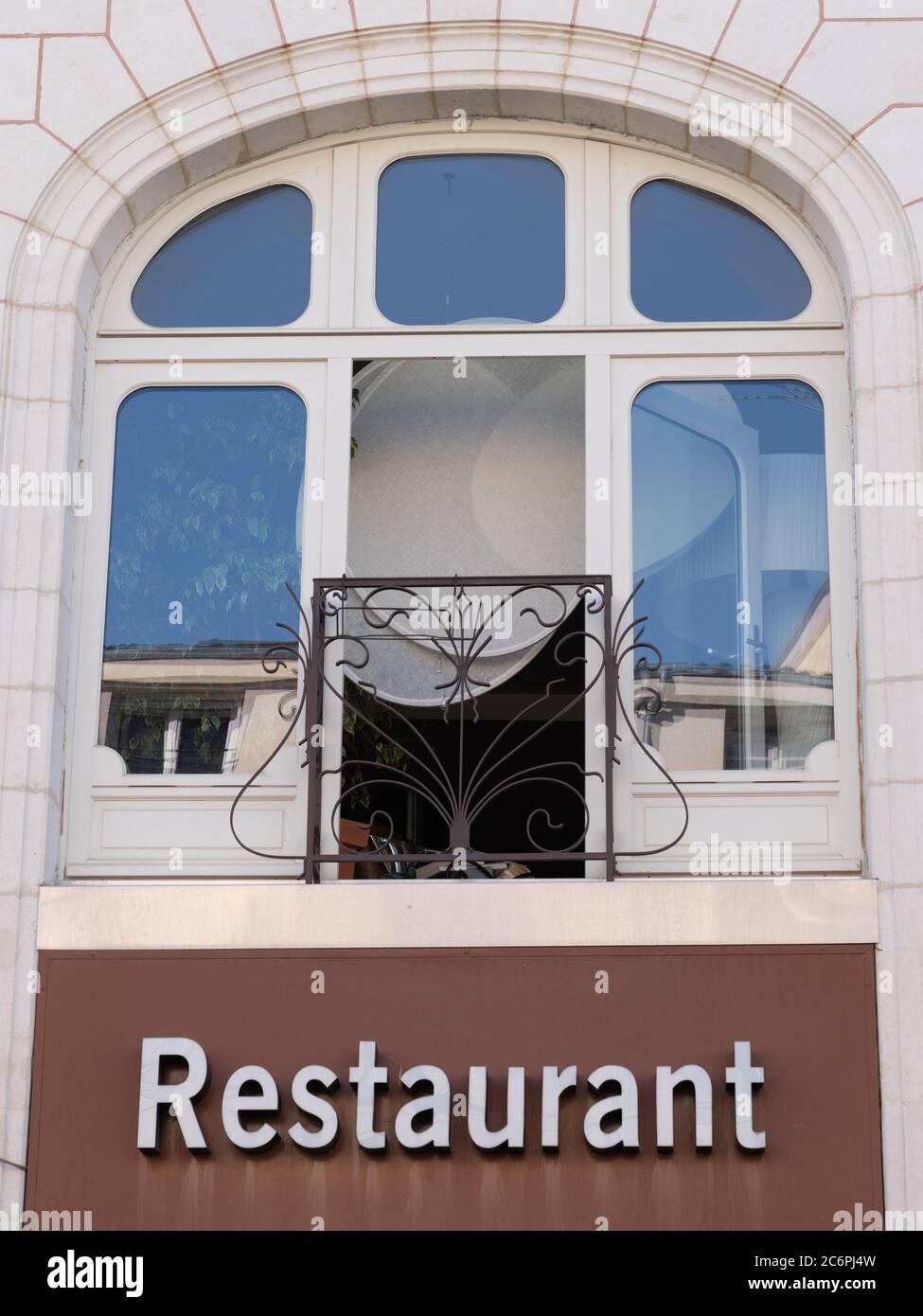 restaurant sign on facade wall with large window Stock Photo - Alamy