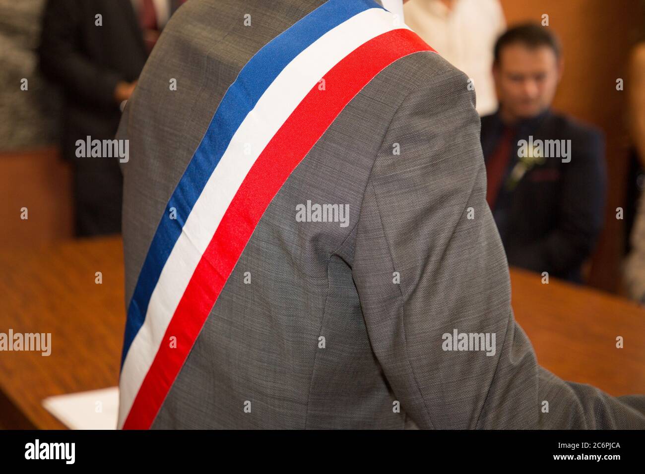 French mayor in grey suit with a scarf flag during a weeding day Stock ...