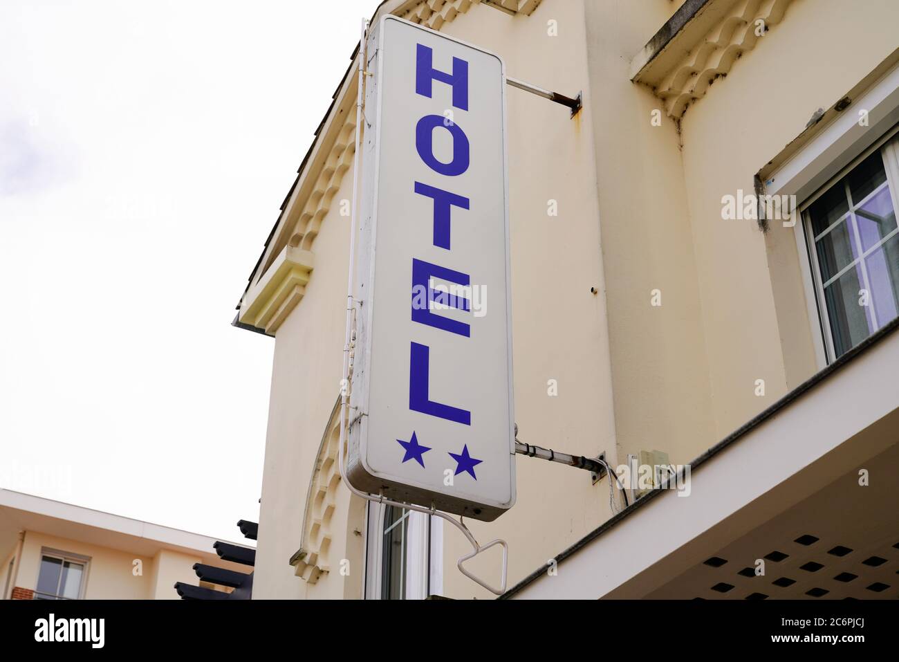 hotel sign two stars on building for vacation Stock Photo - Alamy