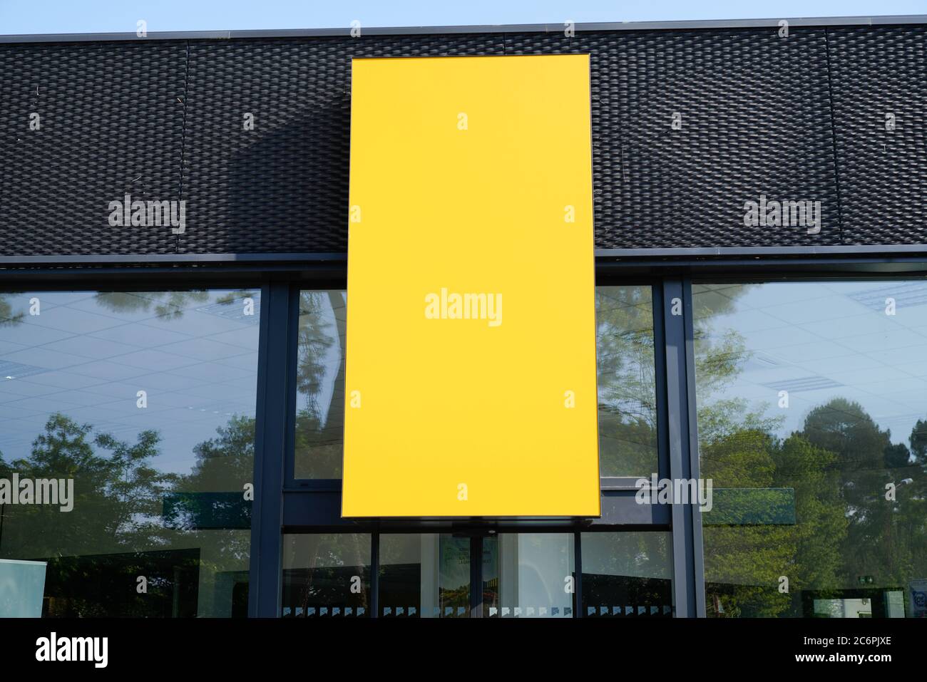 vertical yellow store signage on shop front street Stock Photo - Alamy