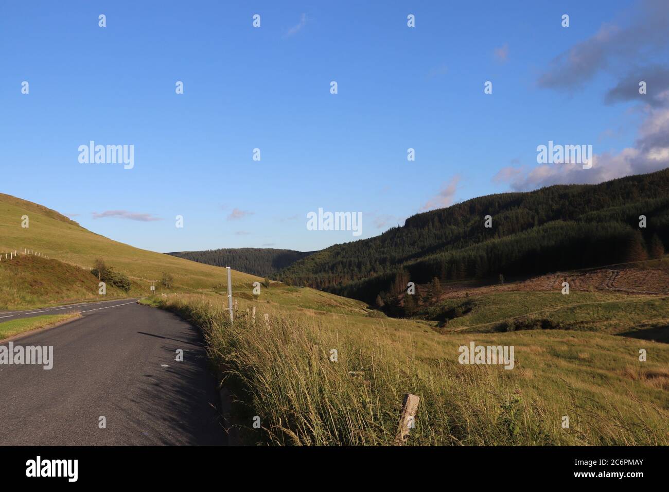 Road running through hills hi-res stock photography and images - Alamy