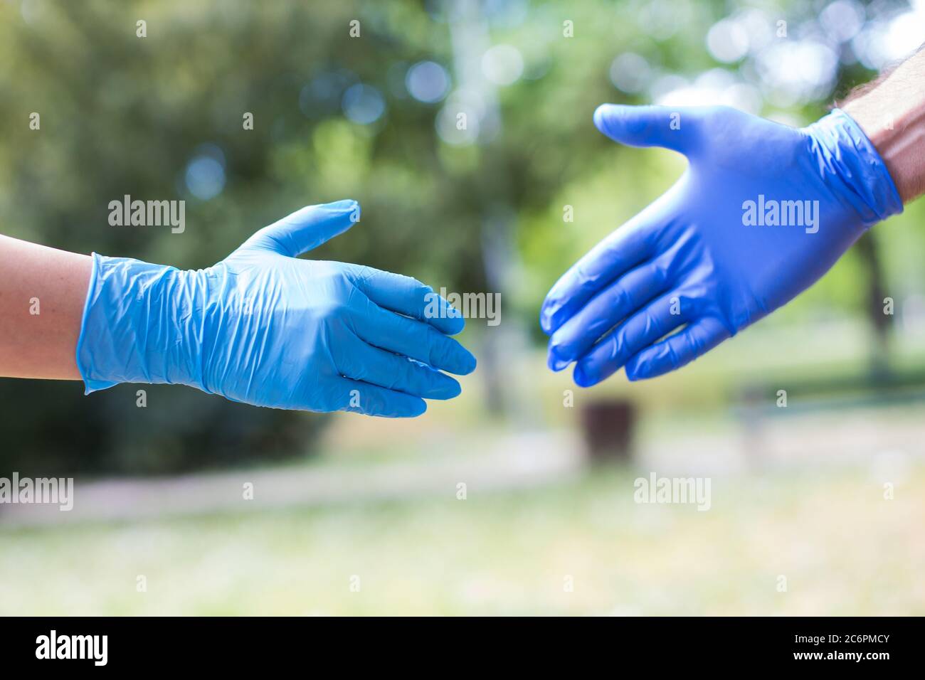 Surgical gloves handshake hi-res stock photography and images - Alamy