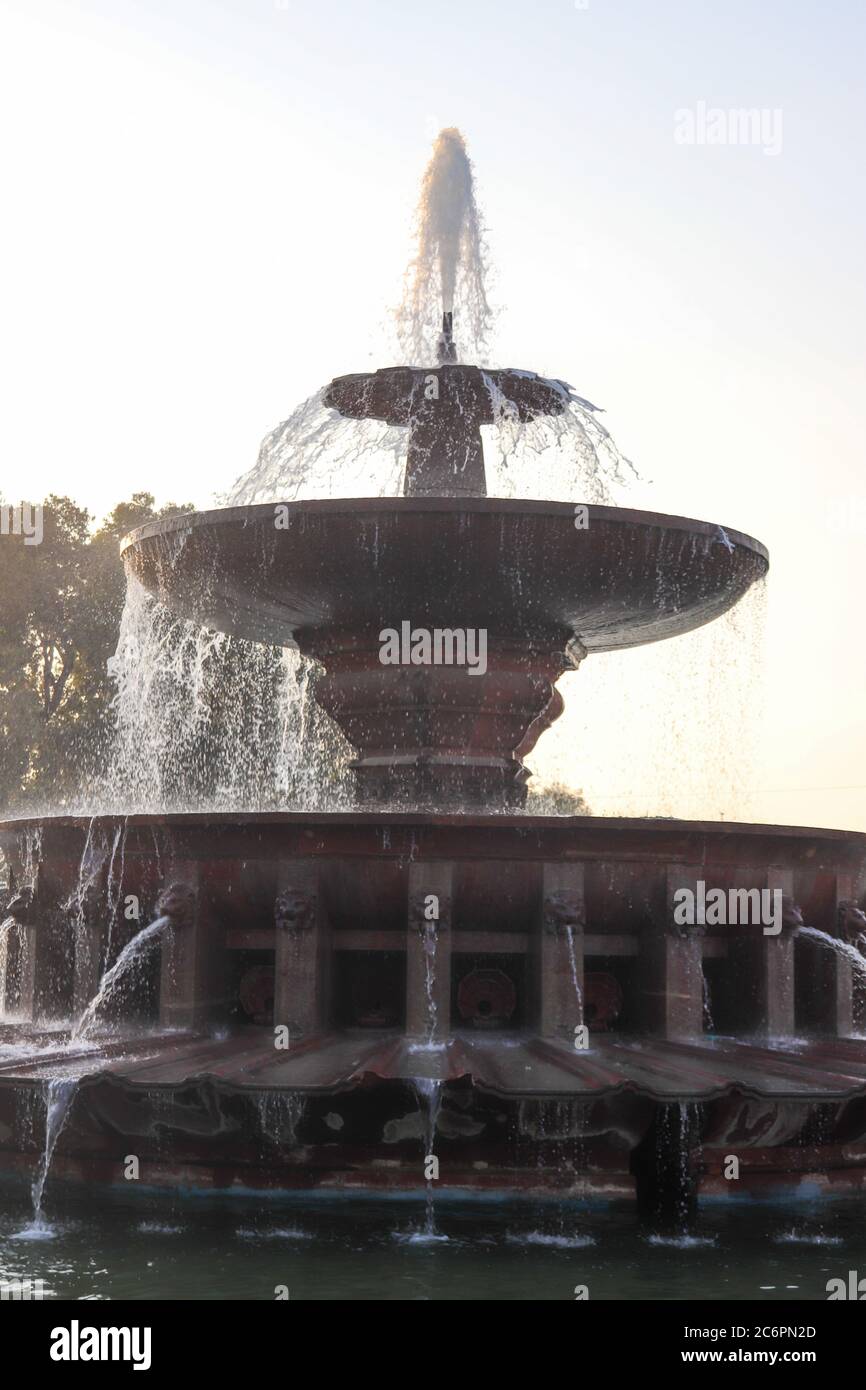 fountain in the sunset. Water fountain isolated Stock Photo - Alamy