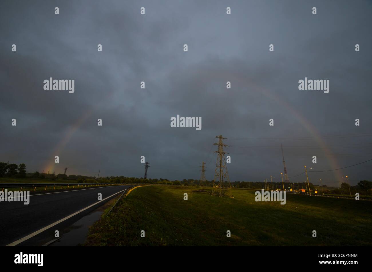Rainbow on the power line. Wires and pillars in the rain Stock Photo ...
