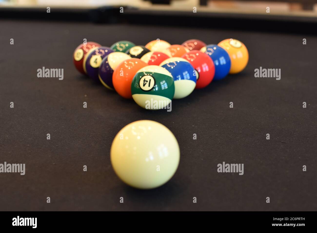 Black billiard table, Playing snooker pool 8ball - Close-up shot of a ...
