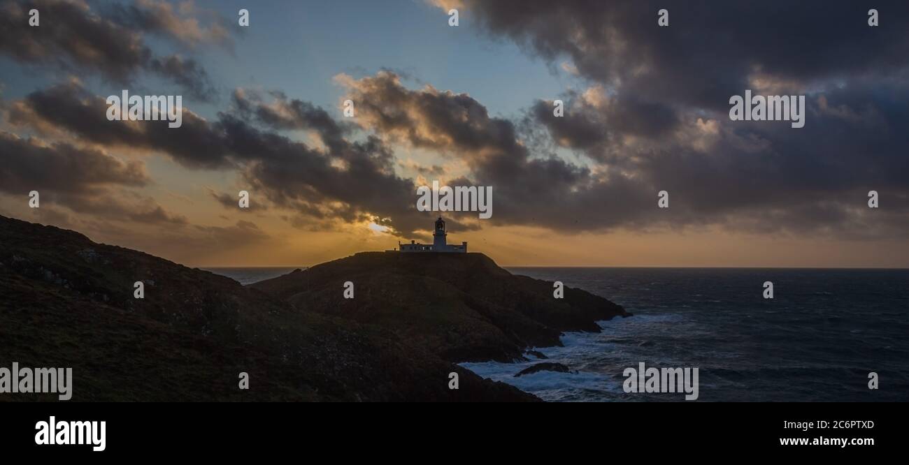 Strumble Head Lighthouse at sunset, Pembrokeshire, Wales, UK Stock ...