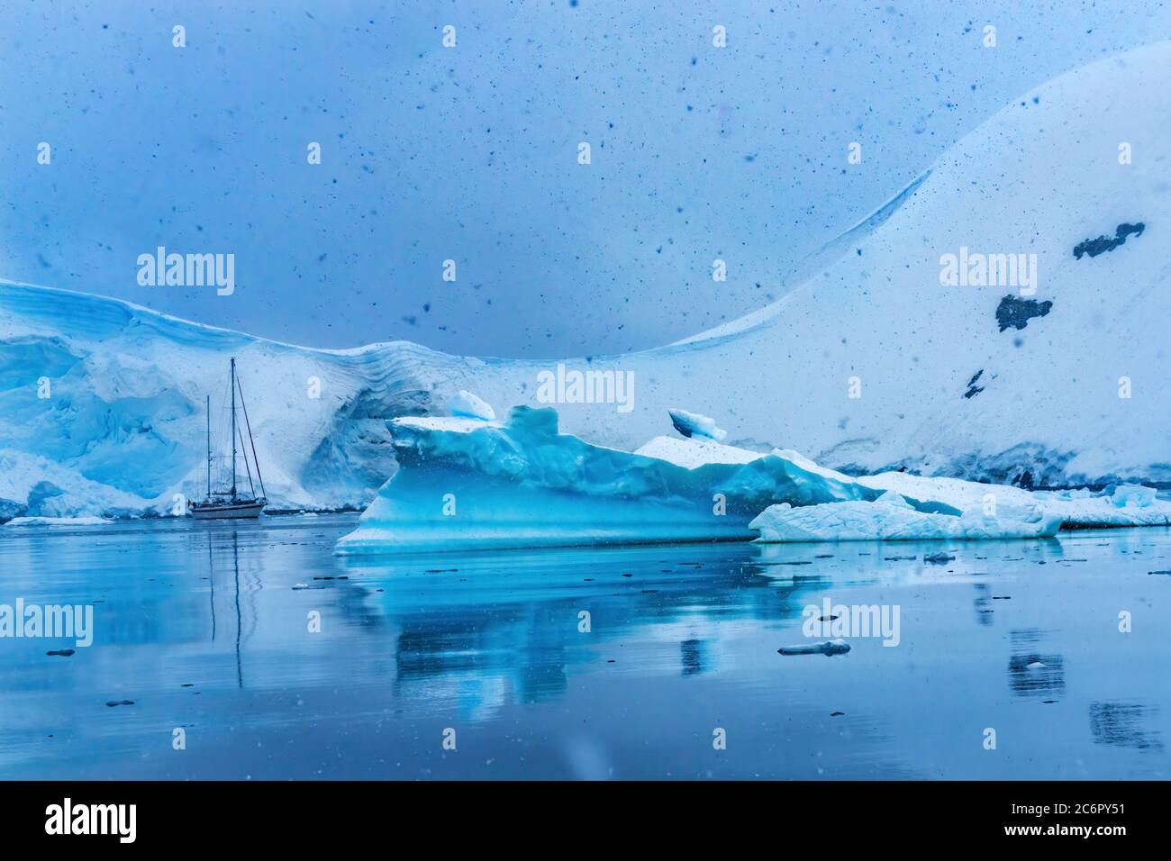 Snowing Sailboat Icebergs Reflection Blue Glacier Snow Mountains ...
