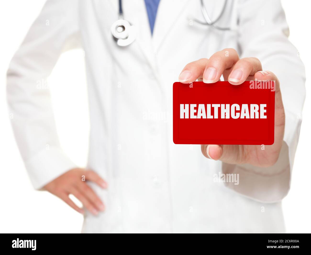 Female doctor holding HEALTHCARE card Stock Photo - Alamy