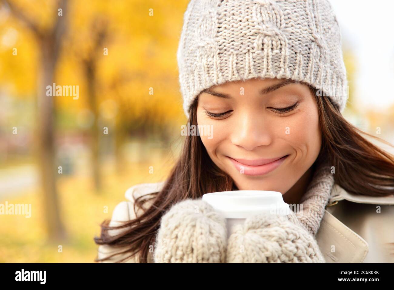 Fall woman drinking coffee Stock Photo - Alamy