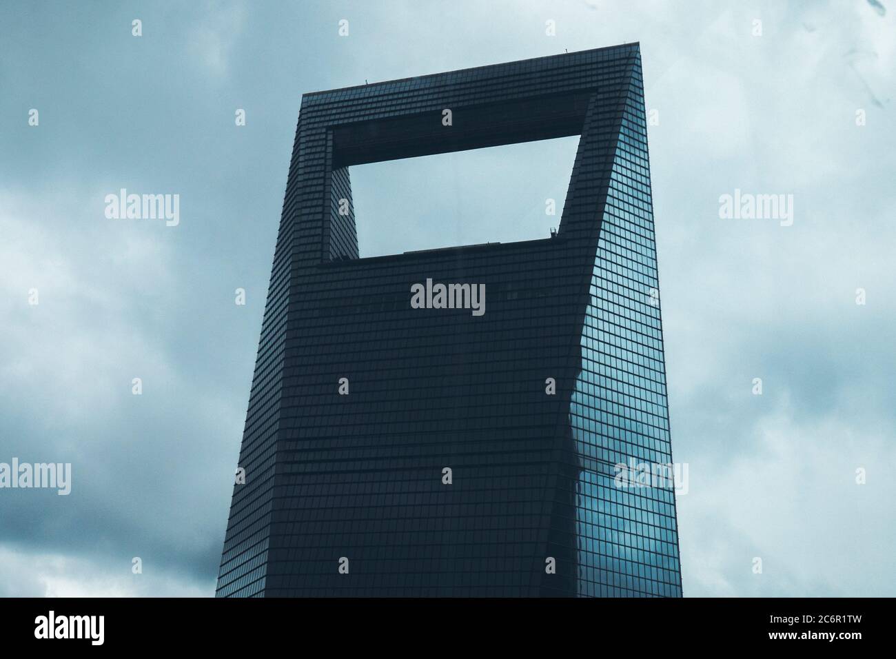 Tall building with hole on the top, city of Shanghai China Stock Photo ...