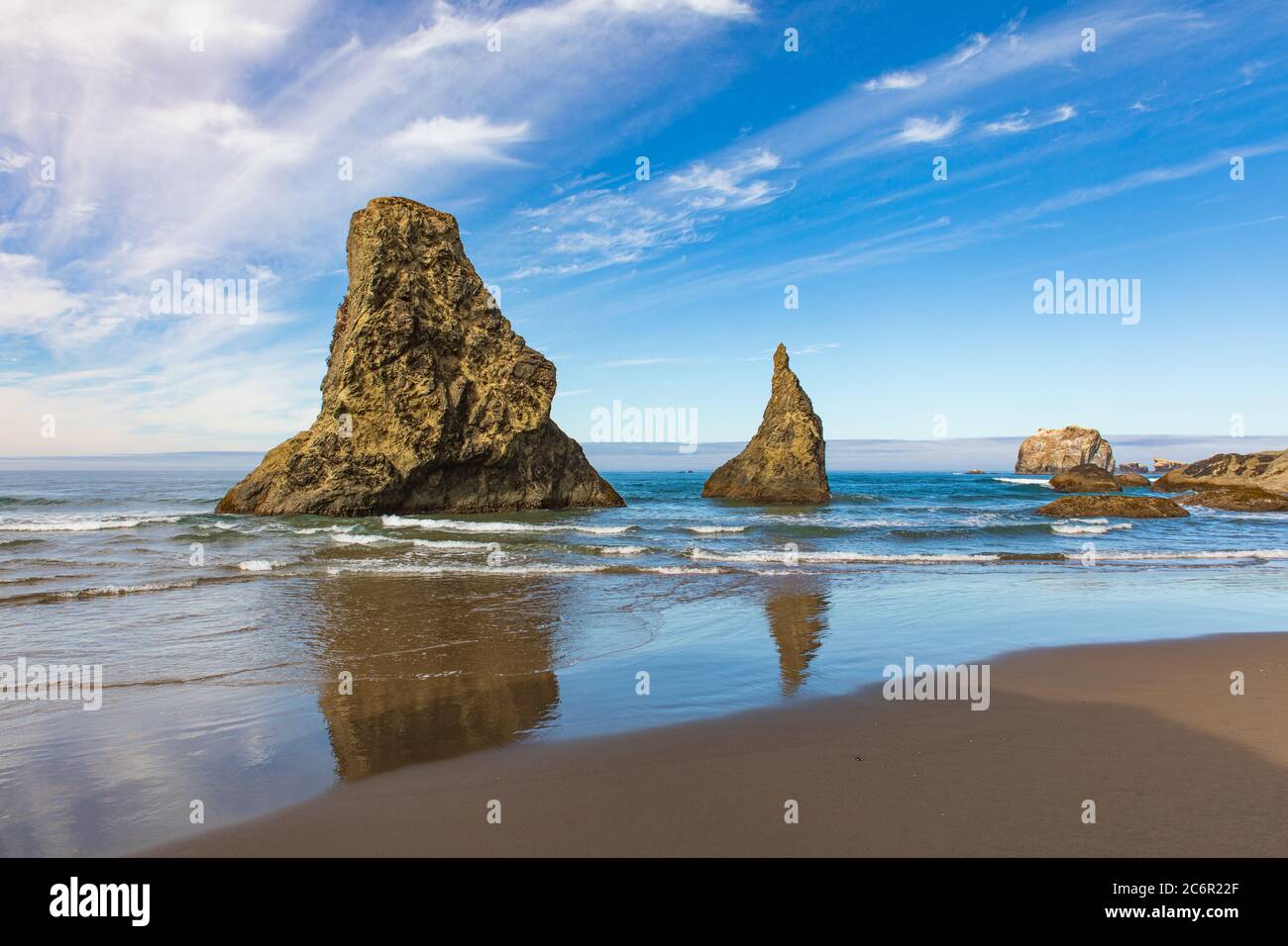 Sea stacks reflecting in the water on Bandon Beach in Oregon Stock ...