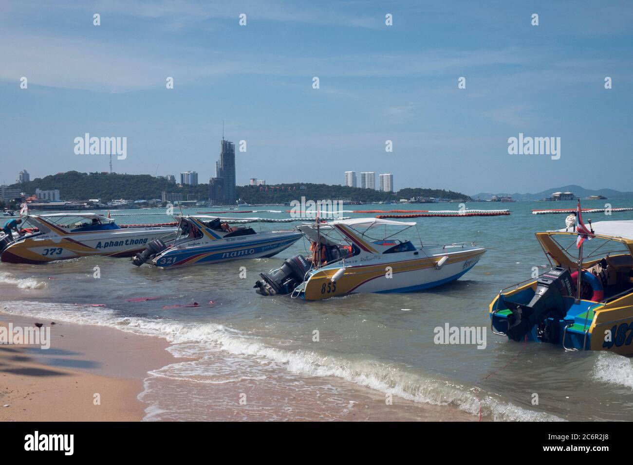 Boats on the beach, city of Pattaya Thailand Stock Photo - Alamy