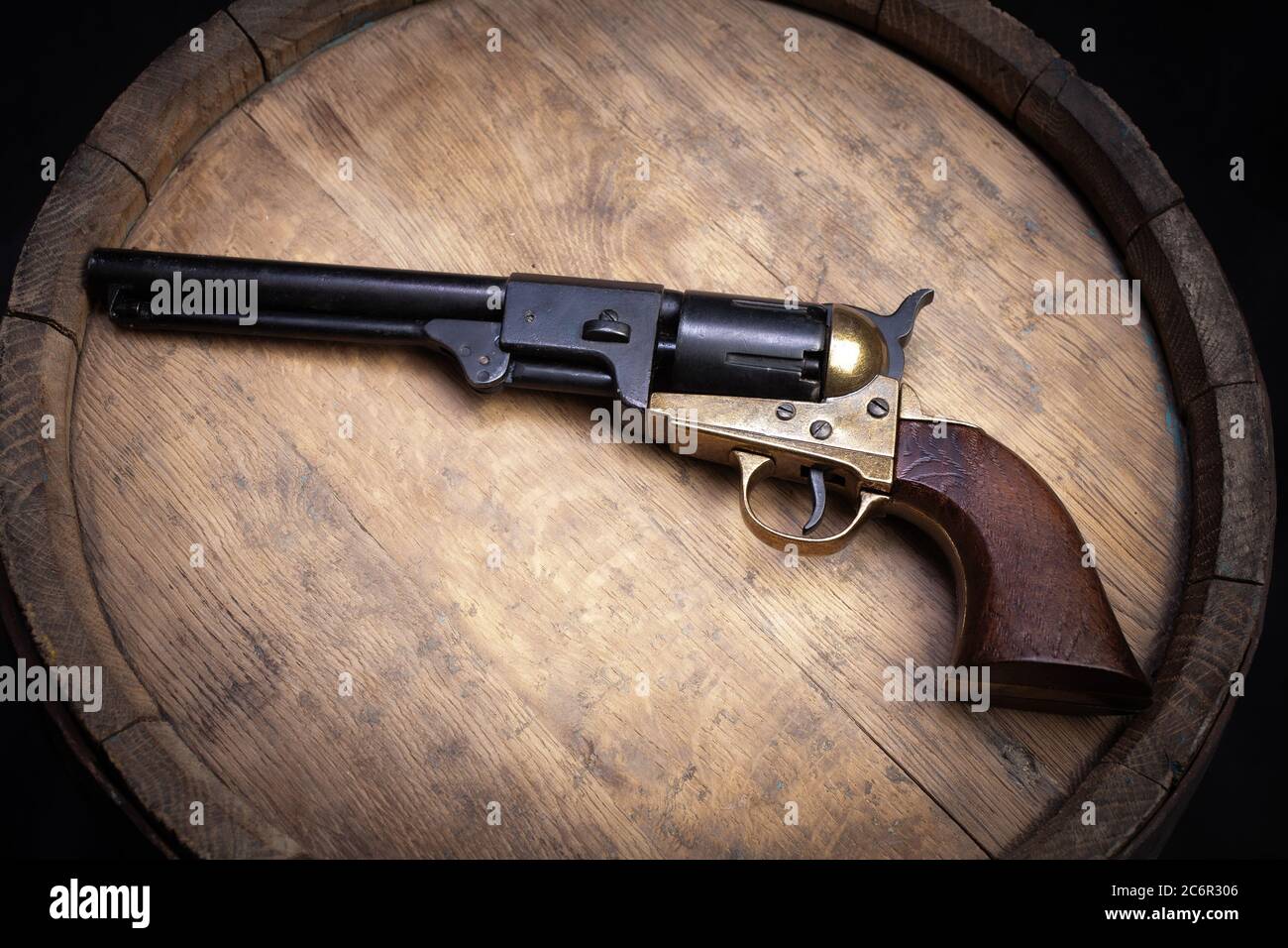 Old West Weapon - Percussion Army Revolver on wooden barrel Stock Photo ...