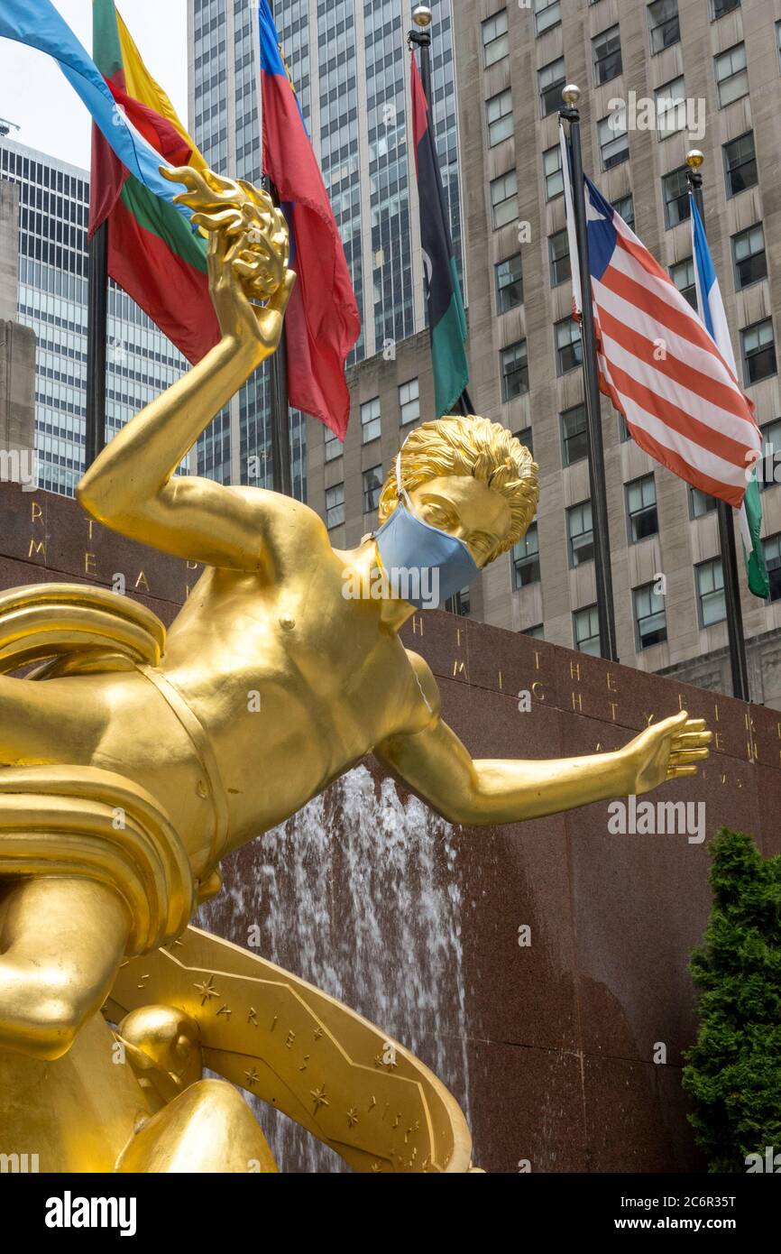 Prometheus in Rockefeller Center features a giant face mask because of ...