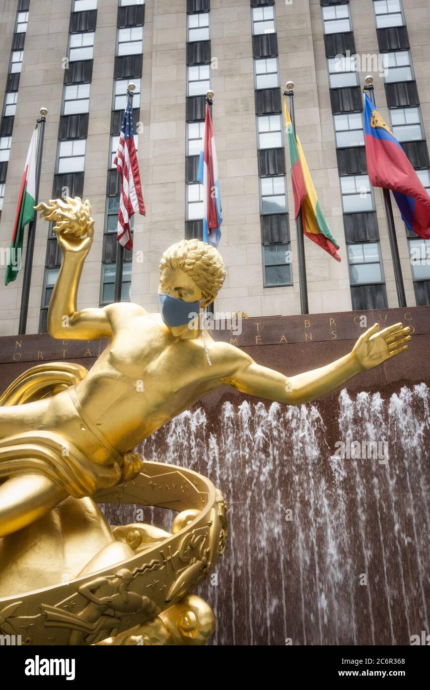 Prometheus in Rockefeller Center features a giant face mask because of ...
