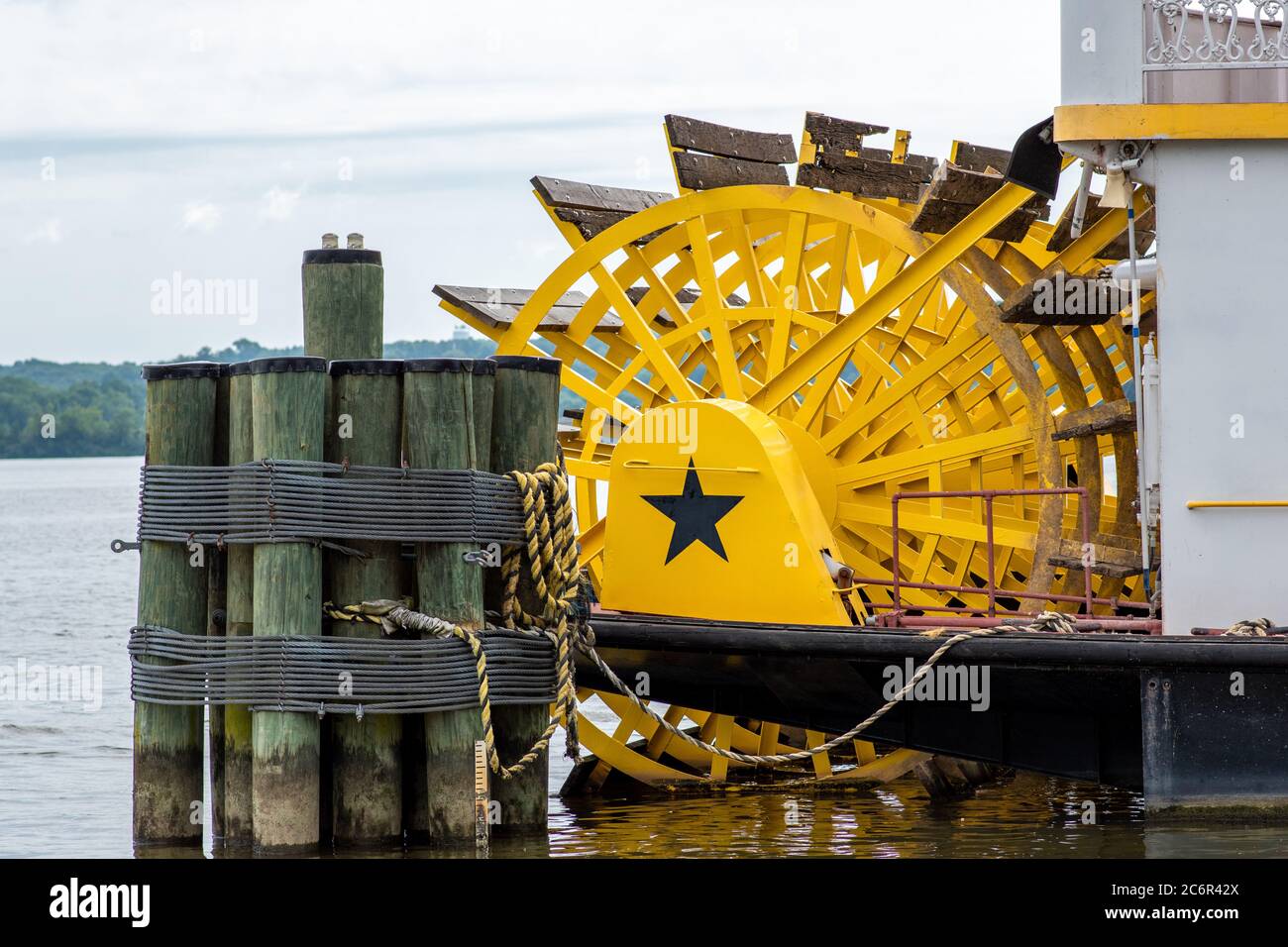 Beautiful yellow stern wheel at a vintage, historic steamboat on the ...