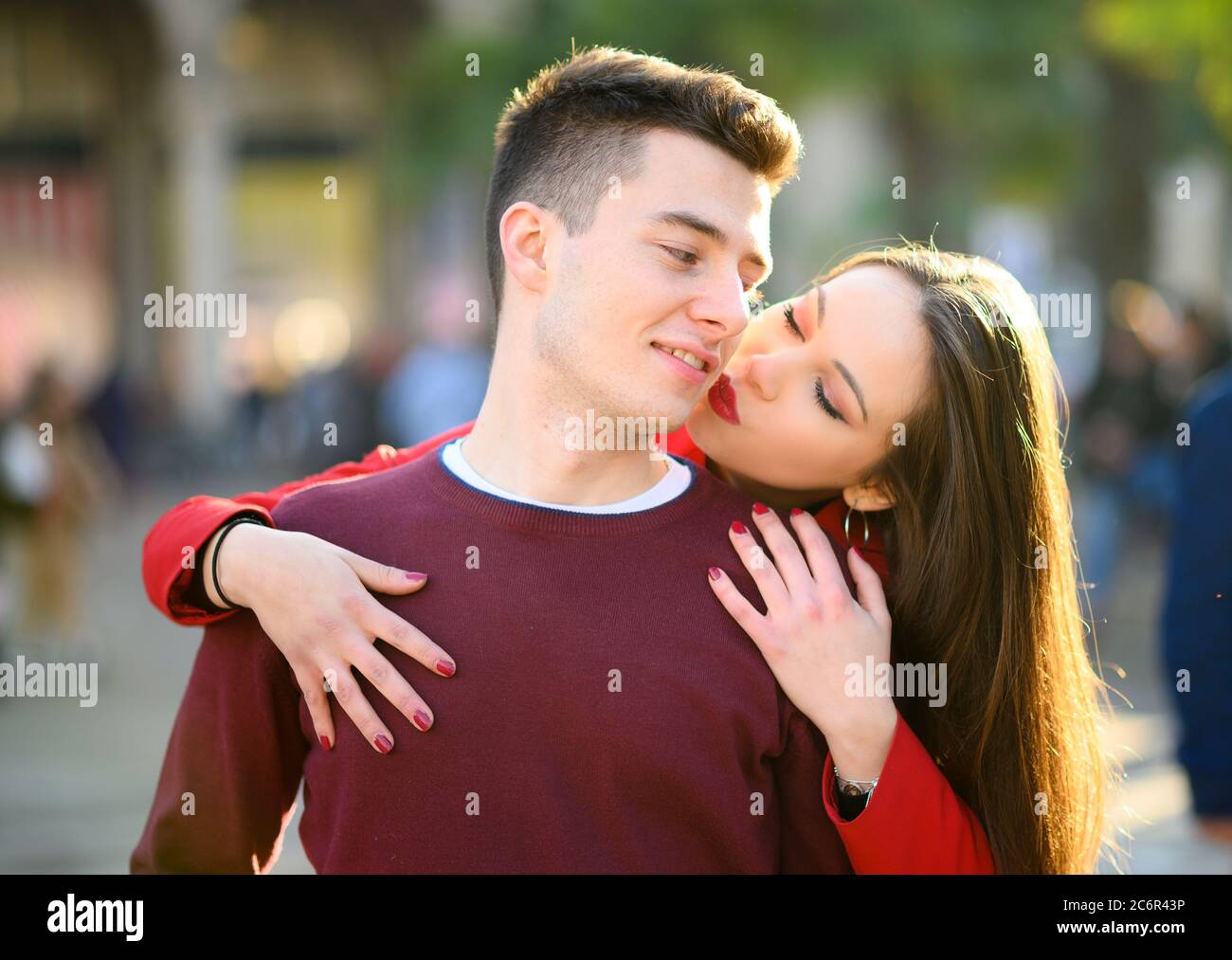 Young couple hugging outdoor with love Stock Photo - Alamy