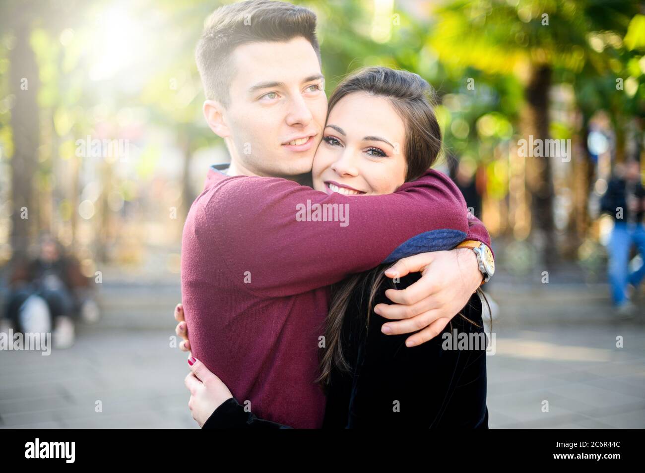 Young couple hugging outdoor with love Stock Photo - Alamy