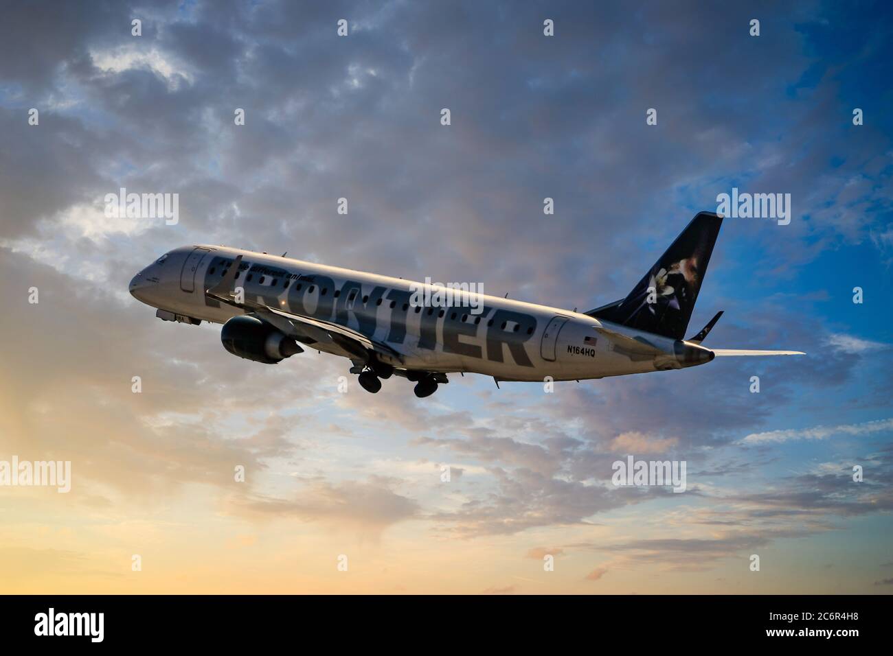 Frontier Airlines CRJ-190 climbs out after take-off from Sarasota ...