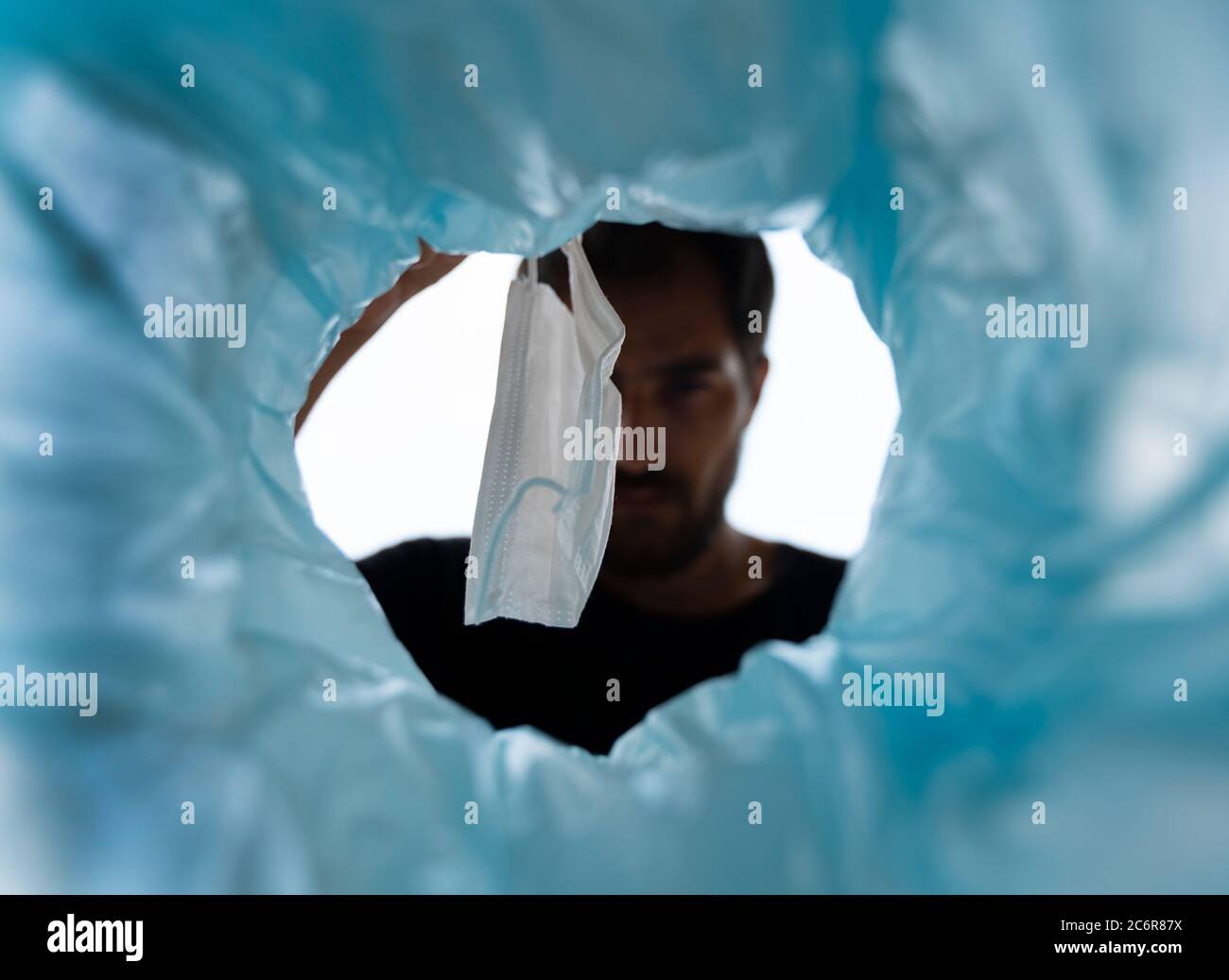 Hand Throw surgical mask in the trash can. Disposable surgical mask ...