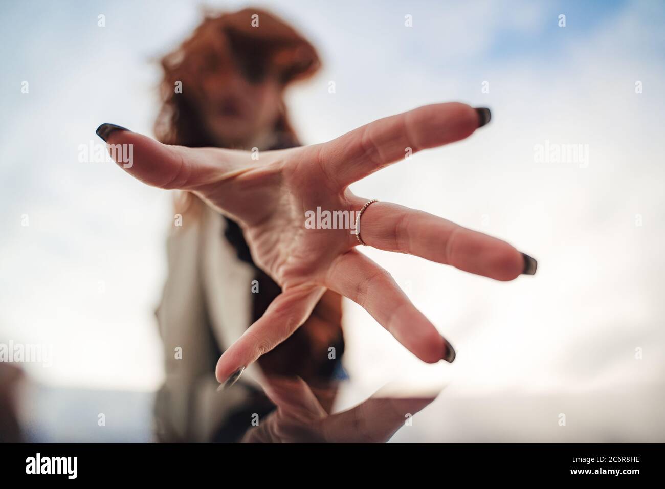 Closeup of fingers of outstretched young woman hand to camera. Female ...