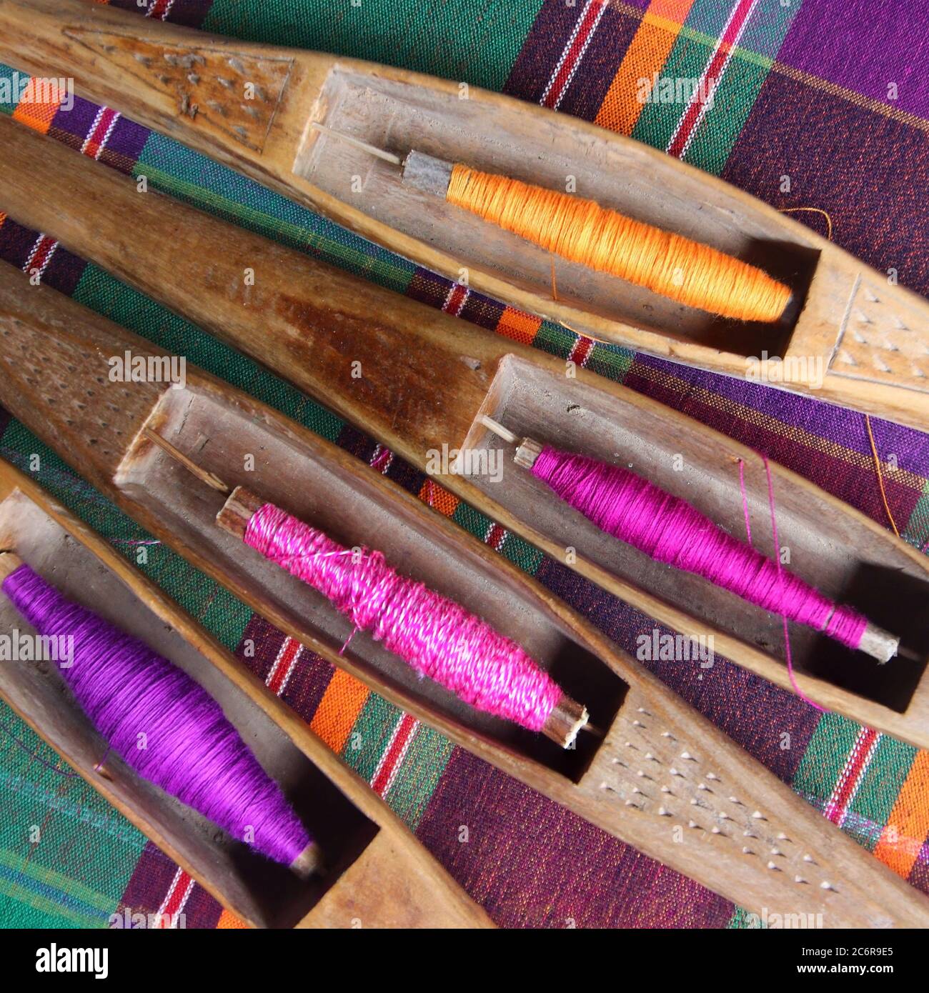 wooden bobbin on silk fabric, traditional weaving of Thai silk Stock ...