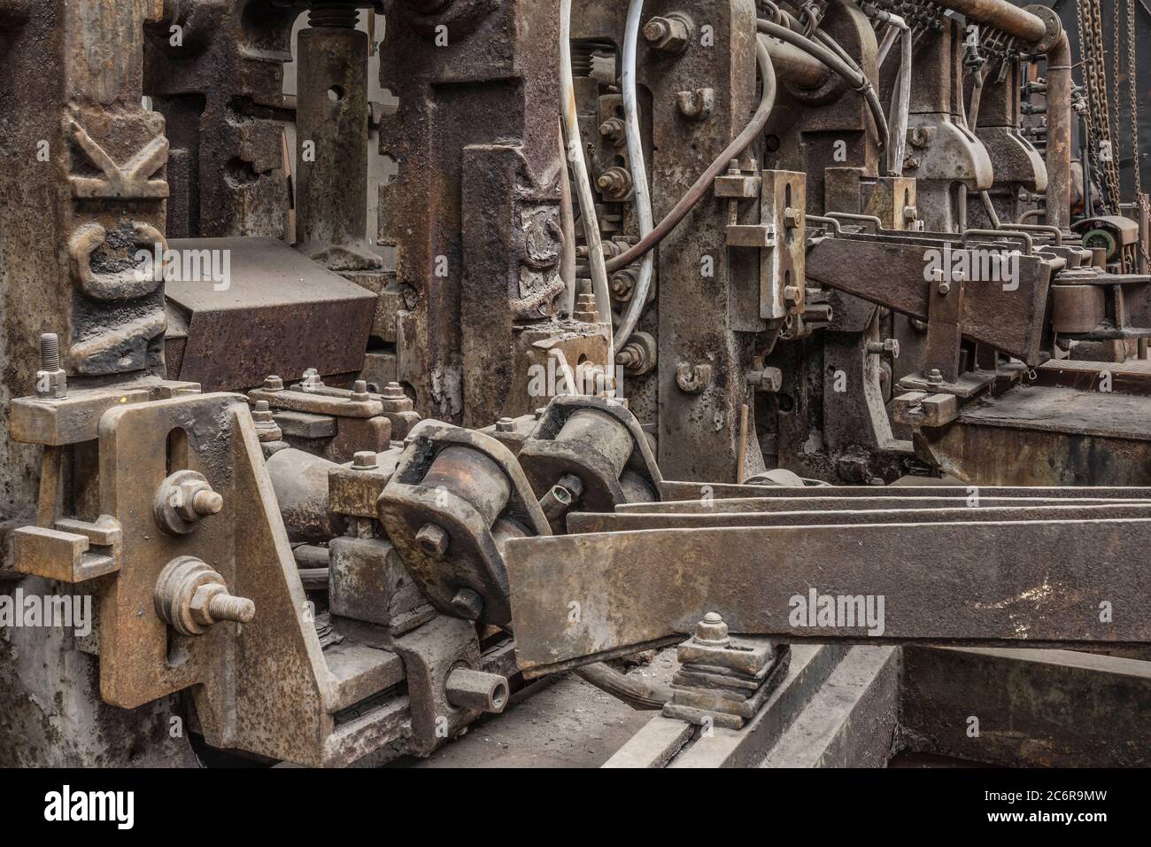 Old rusty steel rolling machinery Stock Photo - Alamy