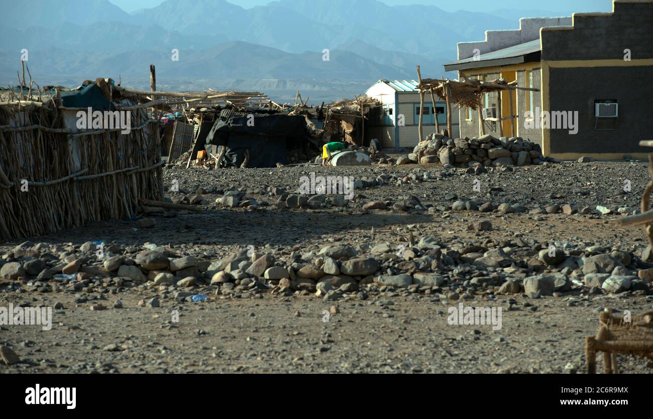 Traditional and modern housing in a remote, indigenous Afar village in ...